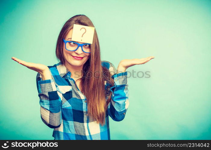 Thinking woman with big nerdy eyeglasses and question mark on forehead ...