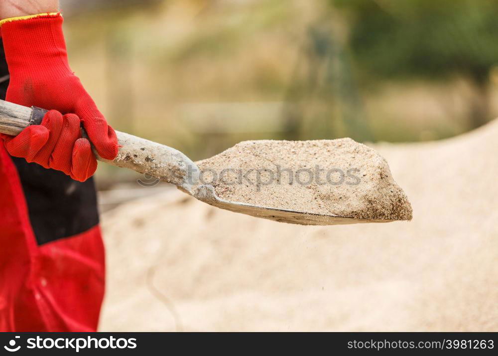 Unrecognizable person worker using shovel standing on industrial ...